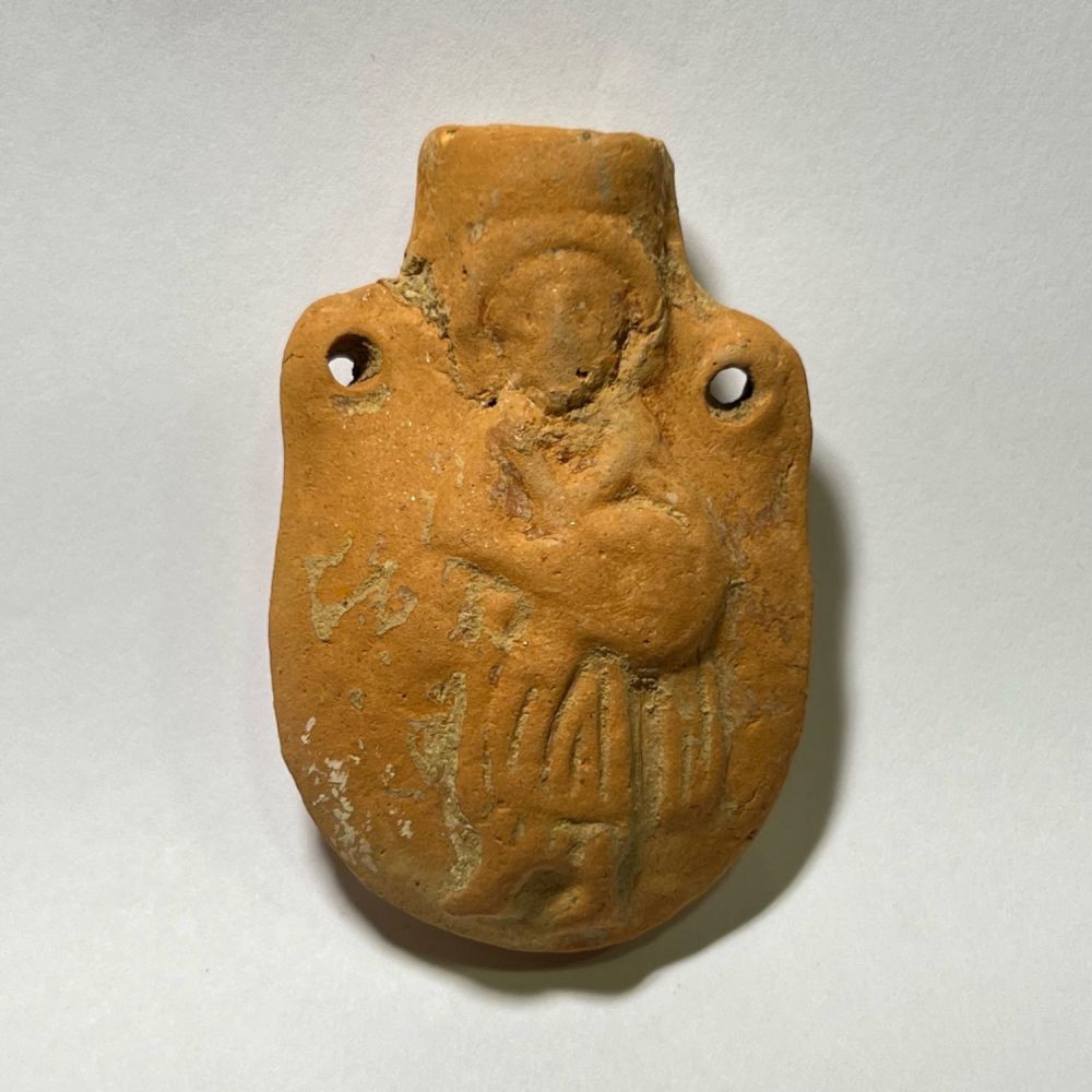 Bidspirit auction | A TERRACOTTA MINI PILGRIM AMPULLA.