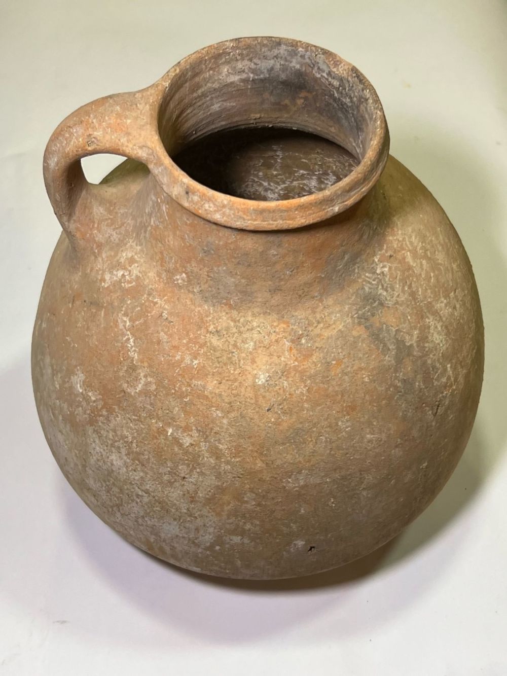 Bidspirit auction | A TERRACOTTA COOKING JUG.